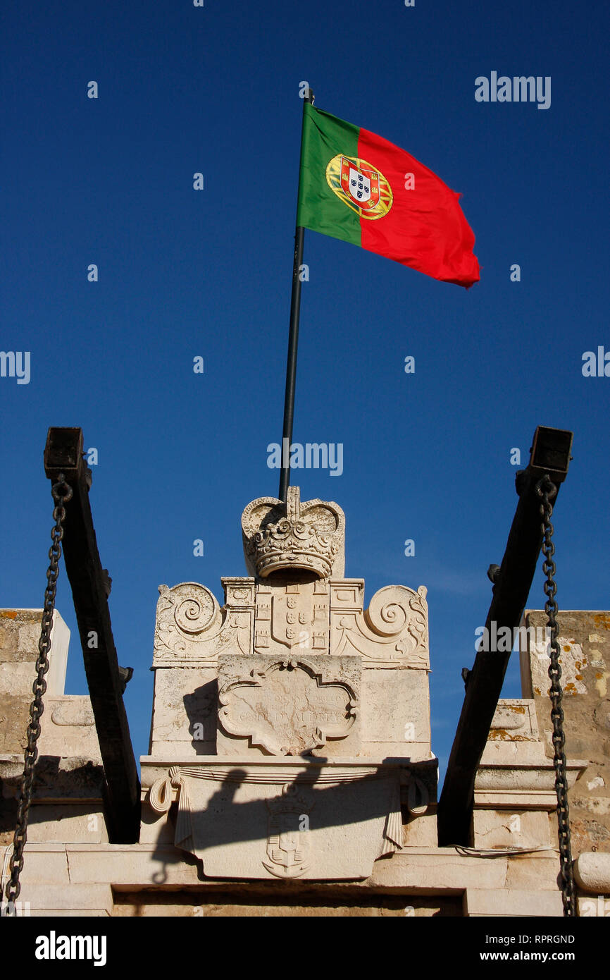Portuguese flag hoisted at the entrance of a fort in Lagos, Algarve ...