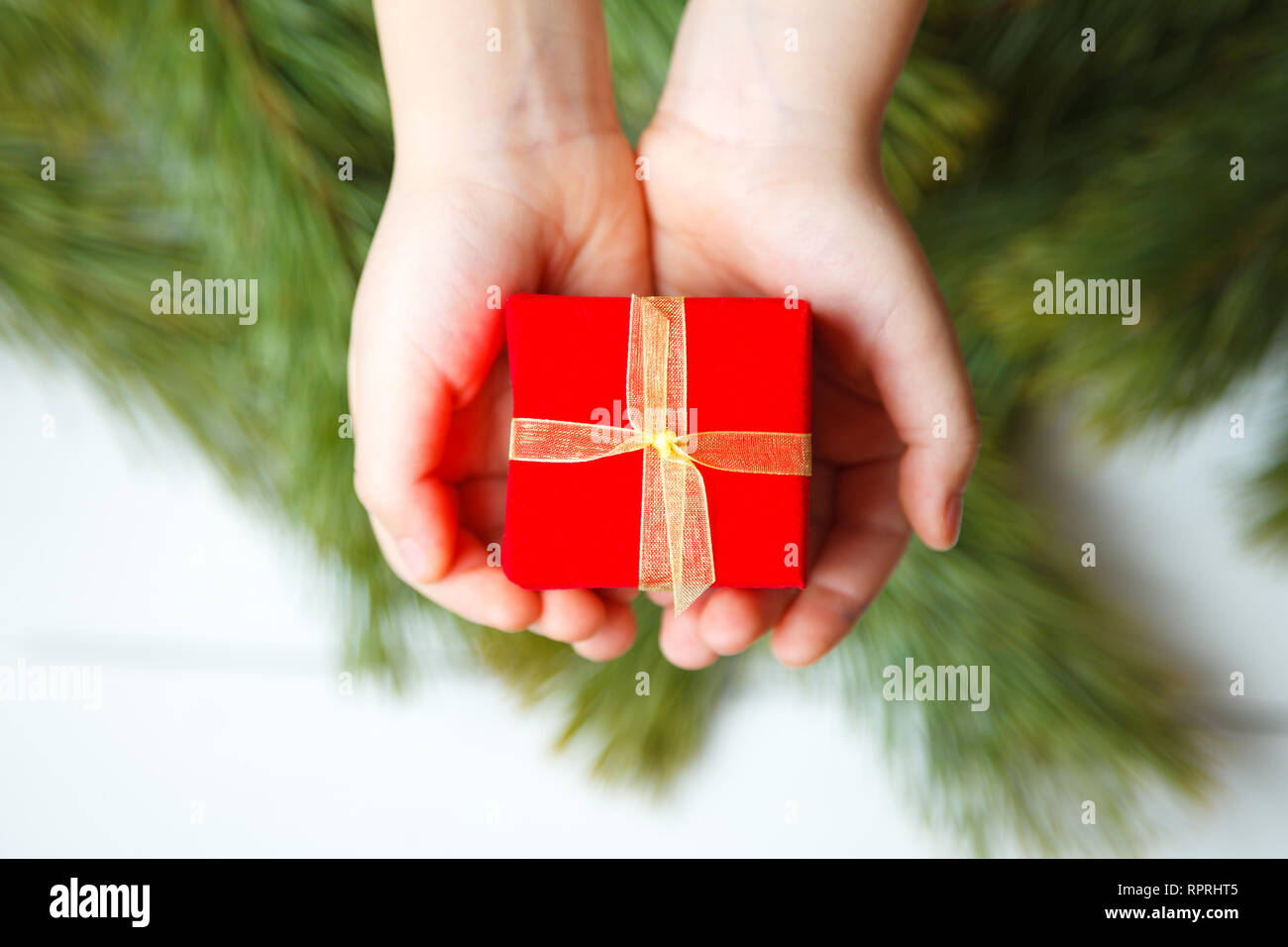 holidays, present, childhood and happiness concept - close up of child ...