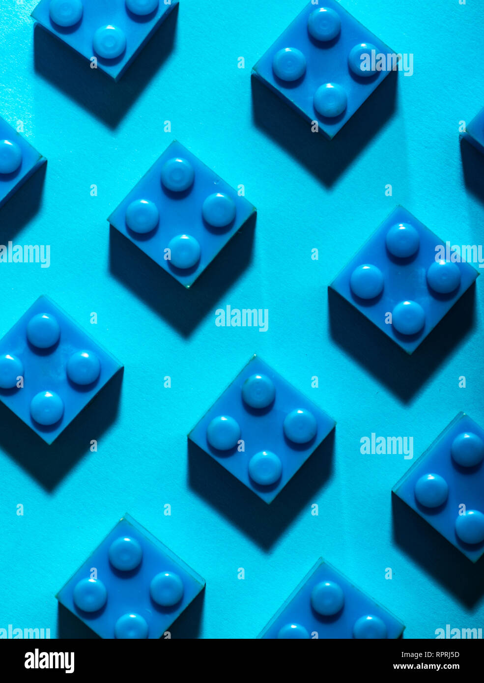 Blue unicolour plastic geometric cubes. Construction toys on geometric ...