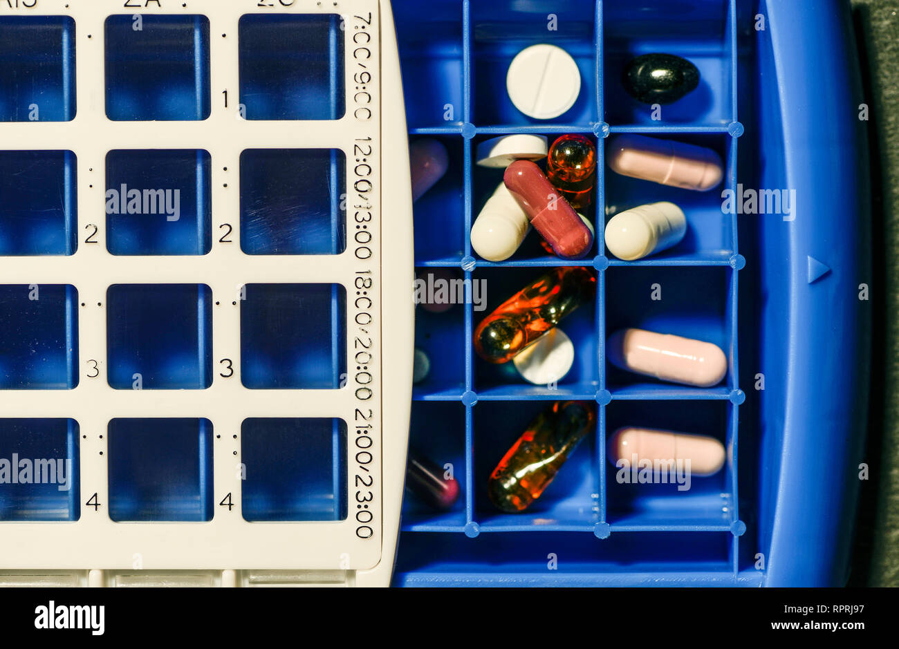 Pills in box with dates. Different medicines separated per dates and ...