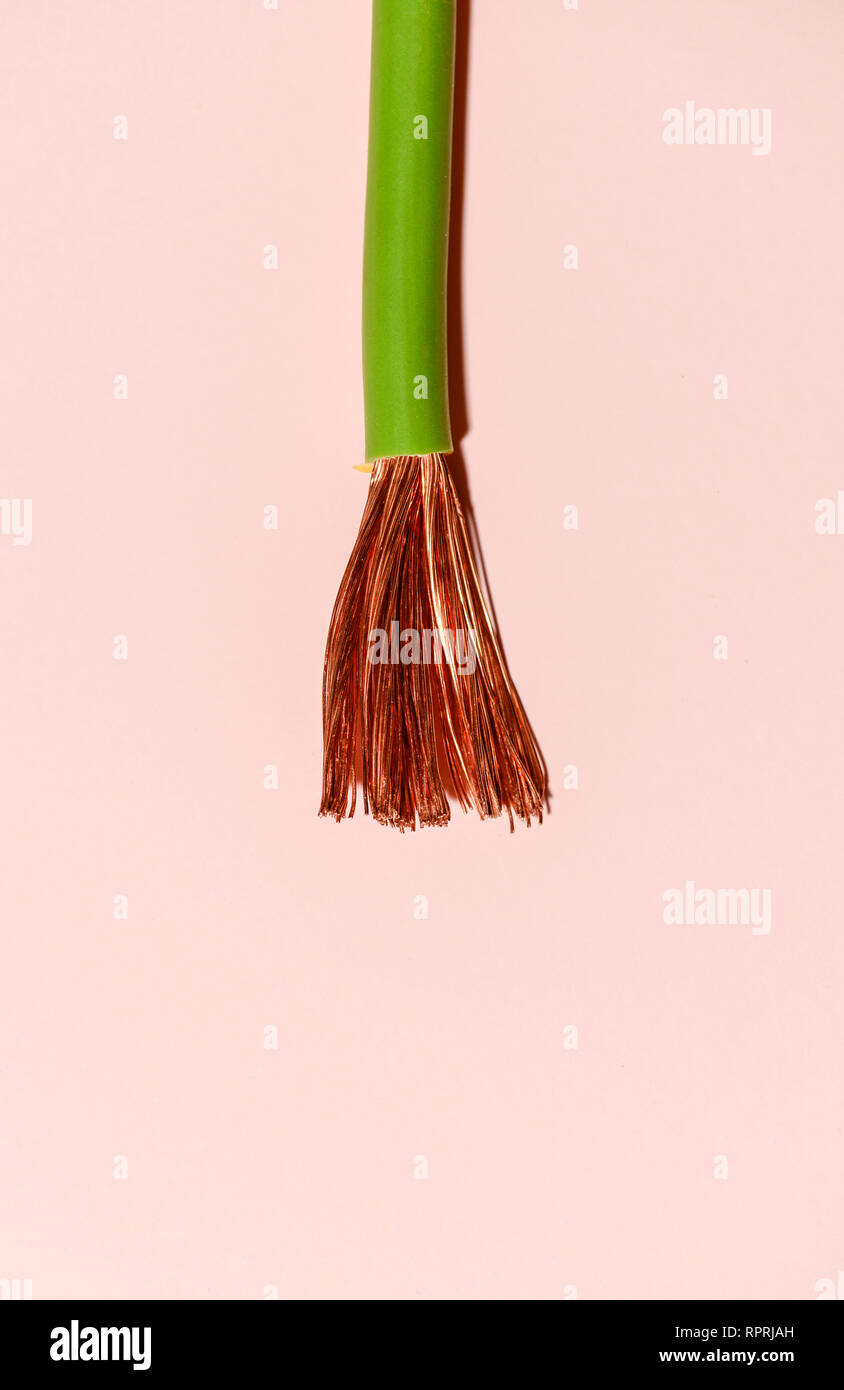 Electrical cable on pink pastel background. Spread out copper wires ...