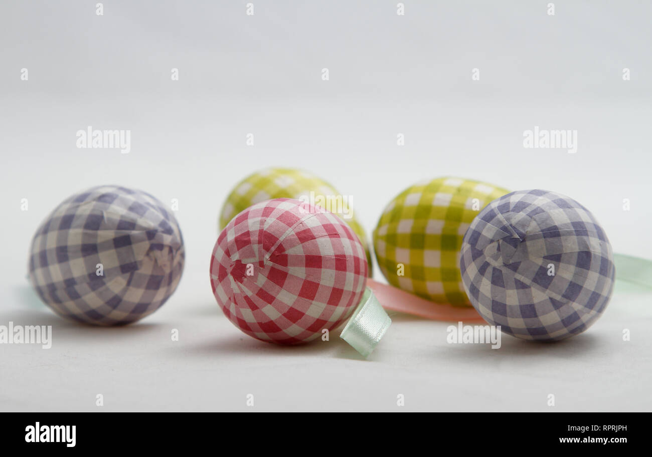 Five colourful textile Easter eggs on white background Stock Photo - Alamy