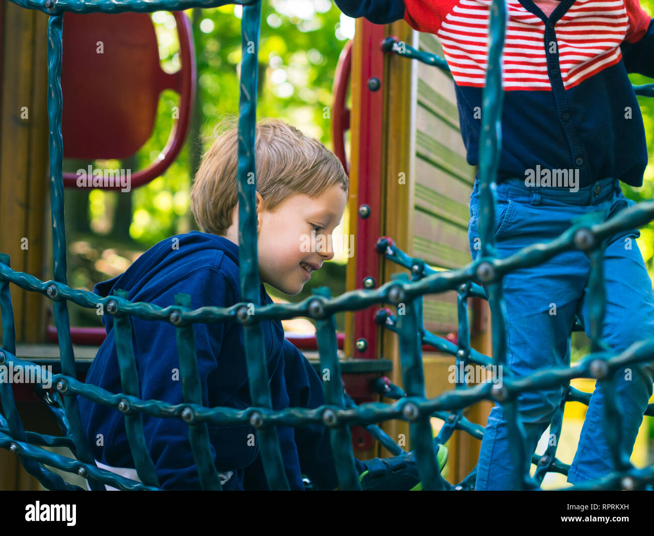 Little 5-year old boy playing on a playground. Active happy child Stock ...