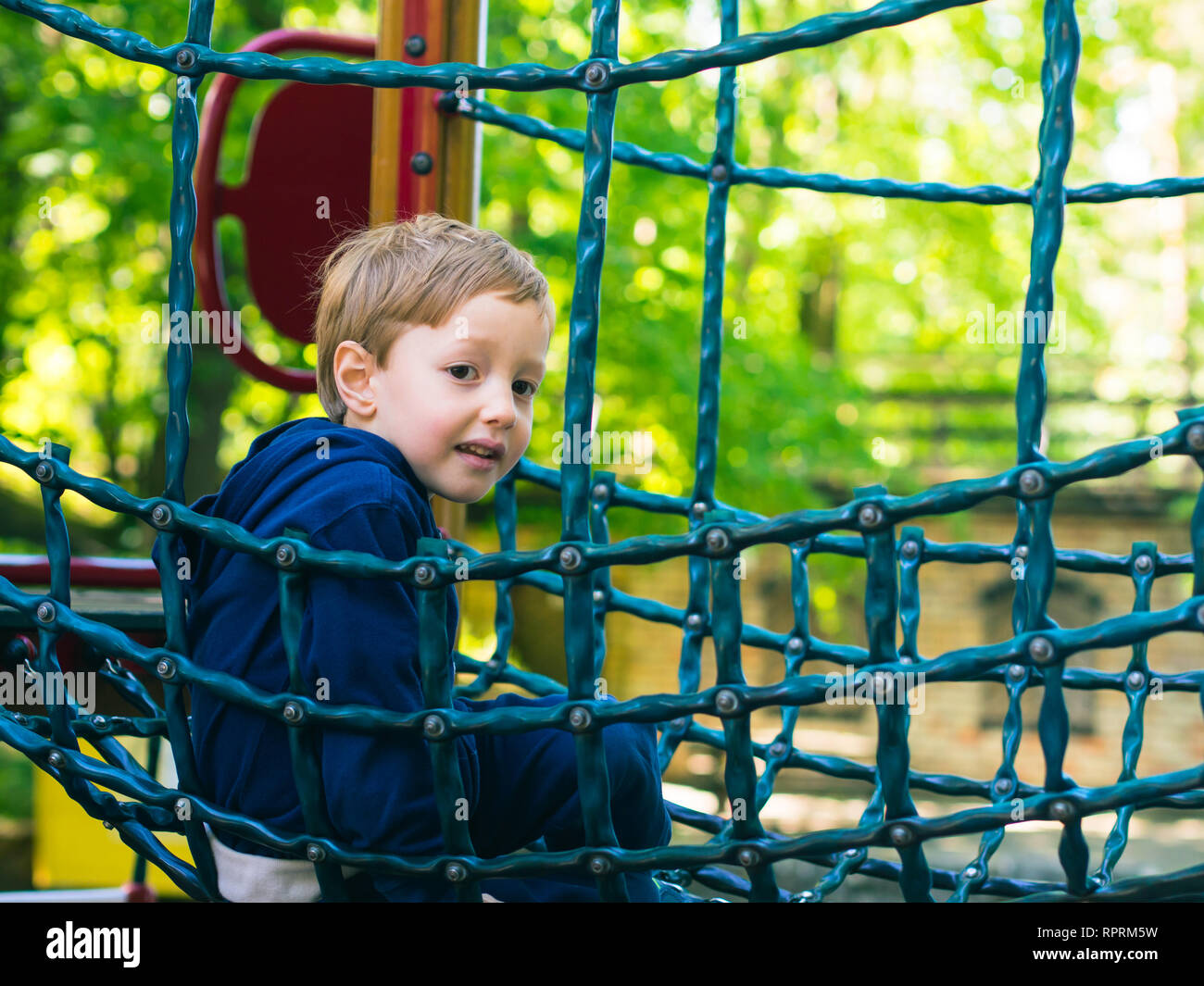 Little 5-year old boy playing on a playground. Active happy child Stock ...