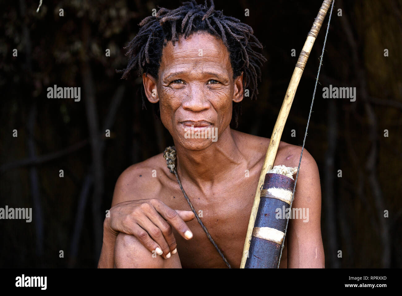 Bushmen of the San people hunting with a bow, Kalahari, Namibia, Africa ...