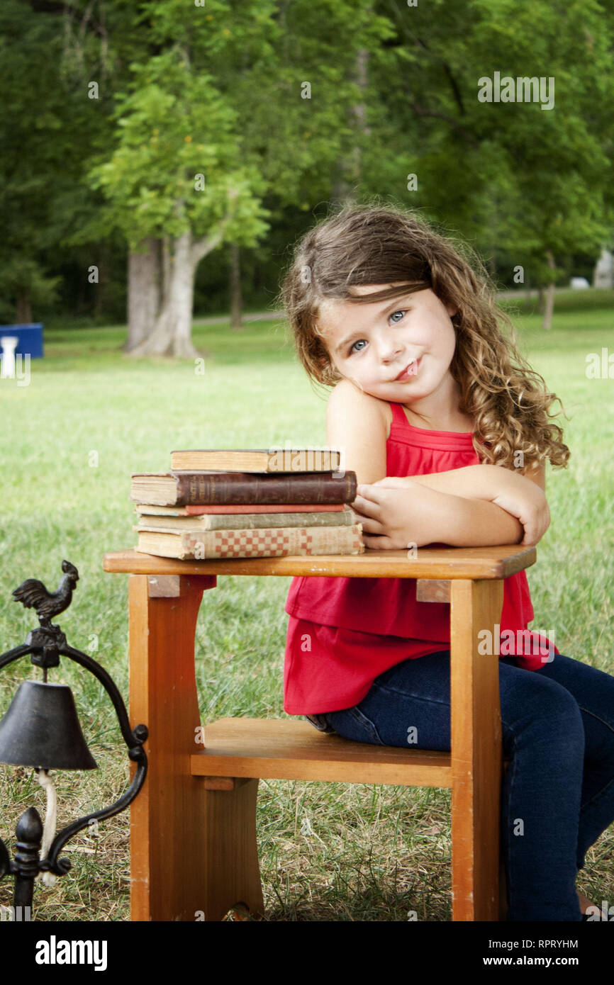 School girl sitting at desk Stock Photo - Alamy
