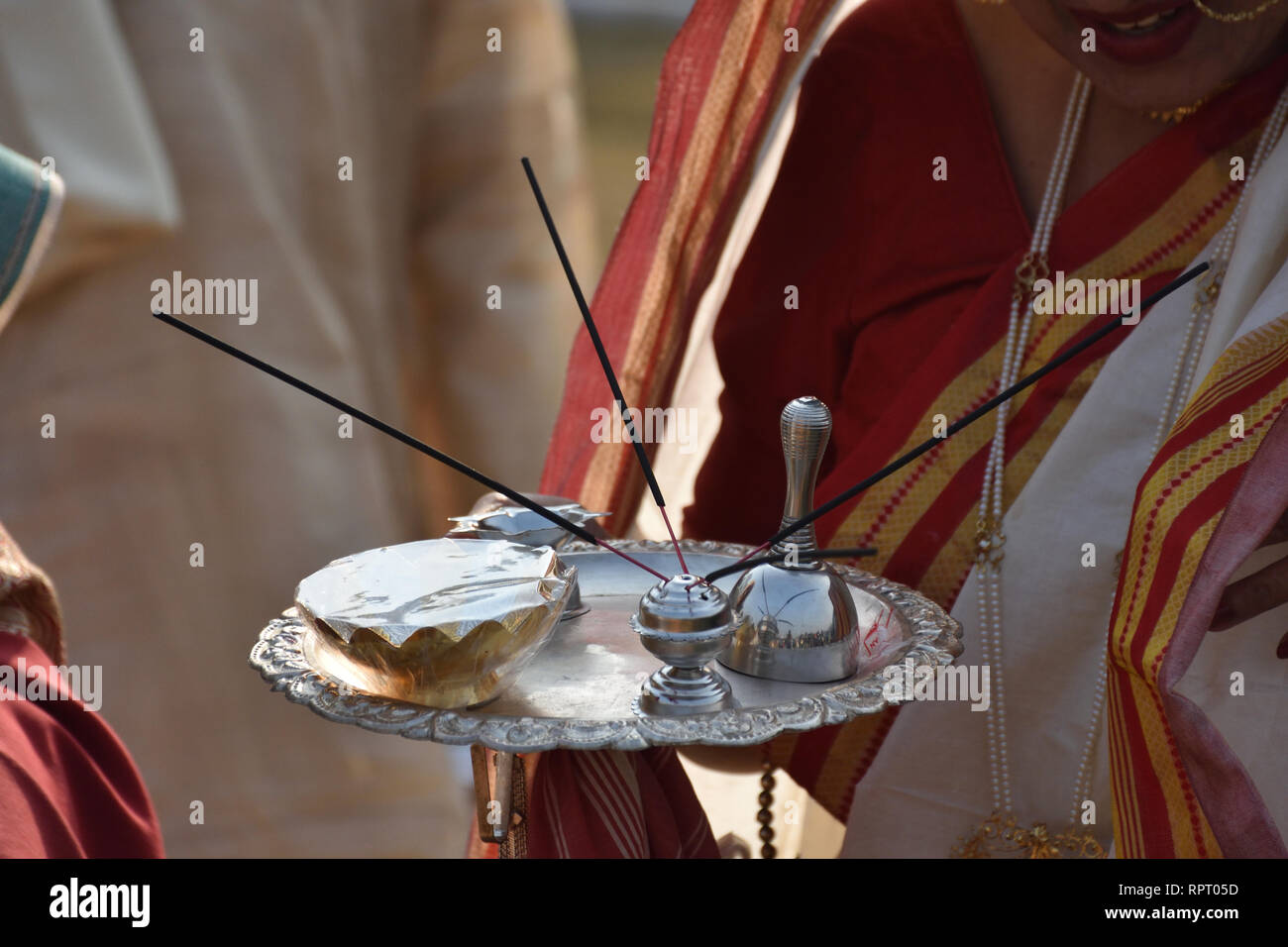 A Bengali Hindu lady holds puja articles with period costume and ...
