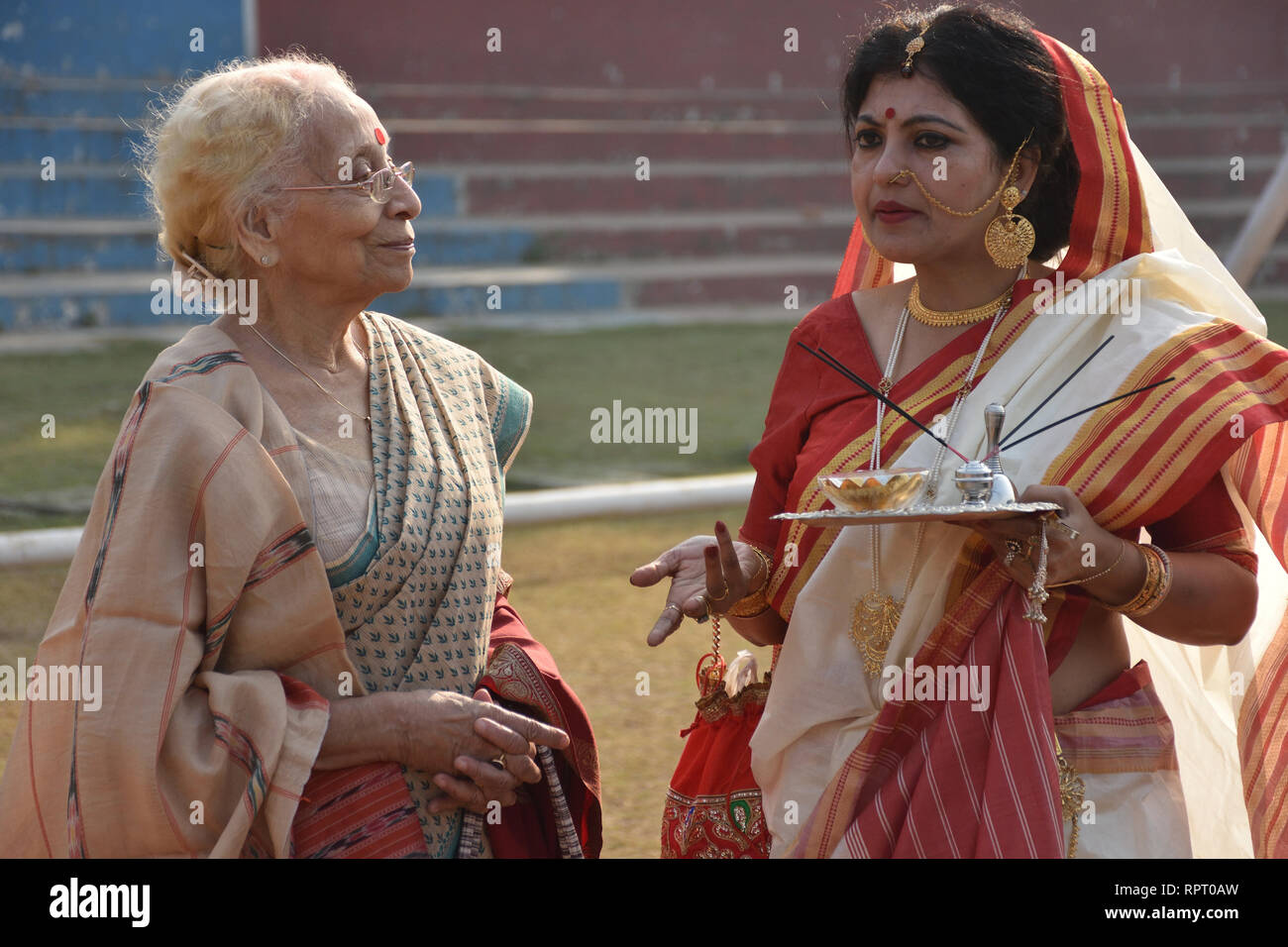 Bengali Hindu ladies poses as puja attitude with period costume and ...