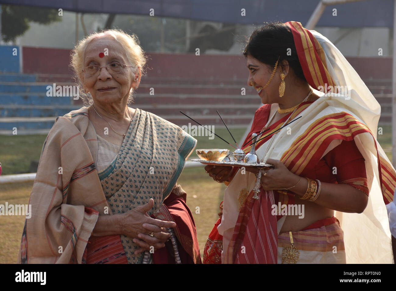 Bengali Hindu ladies poses as puja attitude with period costume and ...