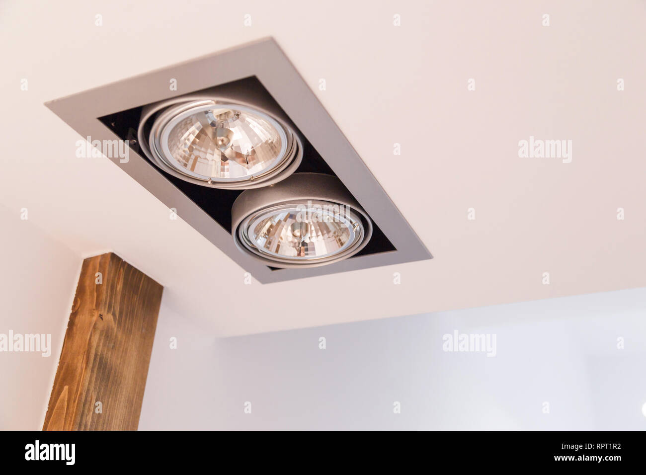 Double ceiling lamp embedded in the ceiling Stock Photo - Alamy