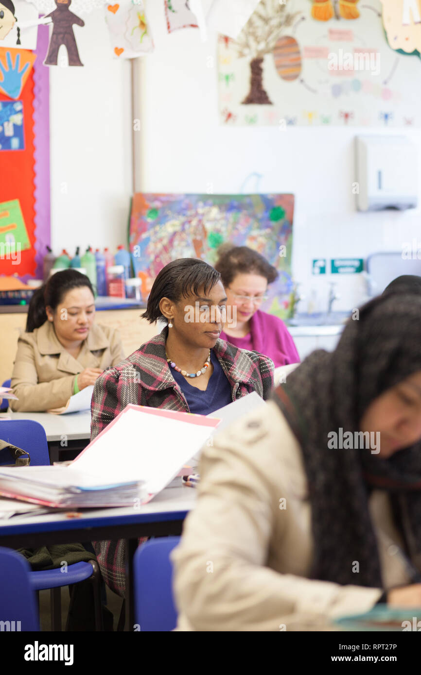 adults in a further education college studying childcare Stock Photo ...