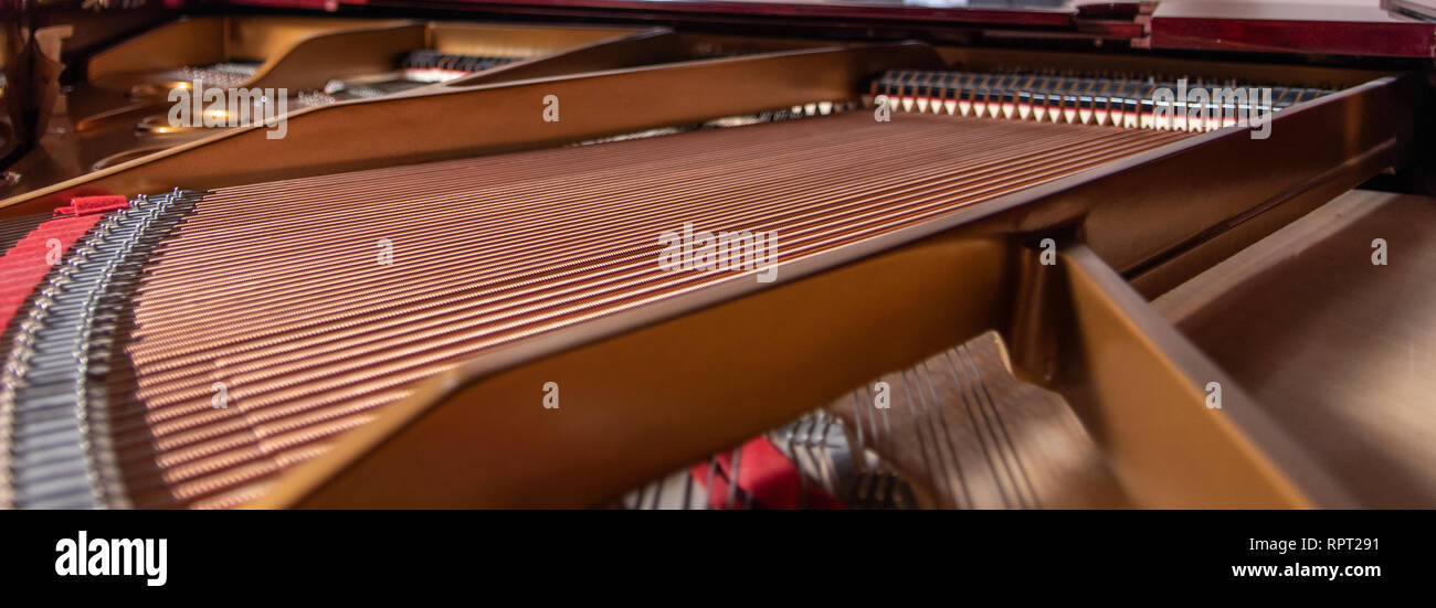 the interior of a grand piano showing the harp and its strings Stock ...