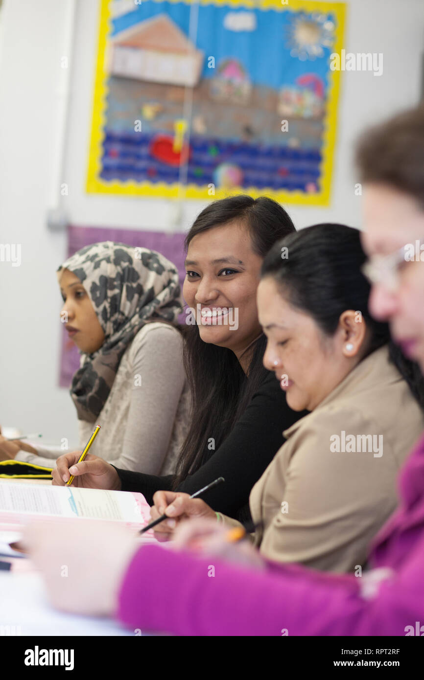 Adult teaching multi cultural hi-res stock photography and images - Alamy
