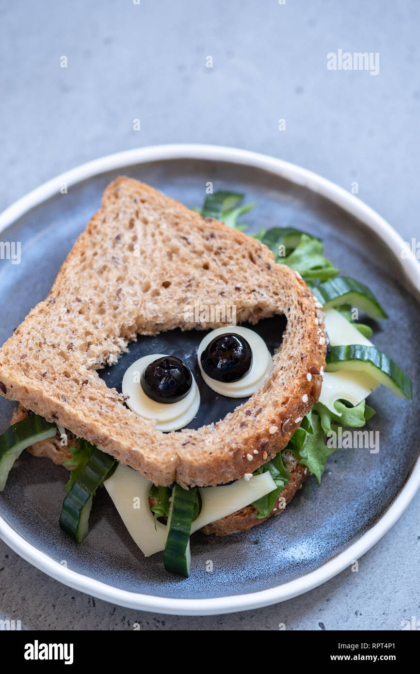 Funny spider sandwich with black cheese and olives for Halloween party ...