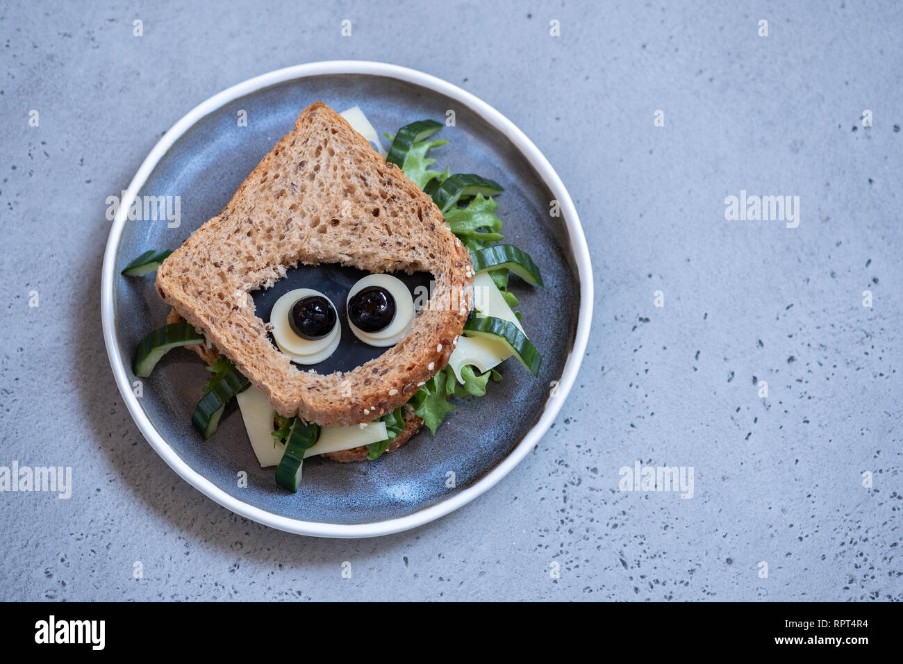 Funny spider sandwich with black cheese and olives for Halloween party ...