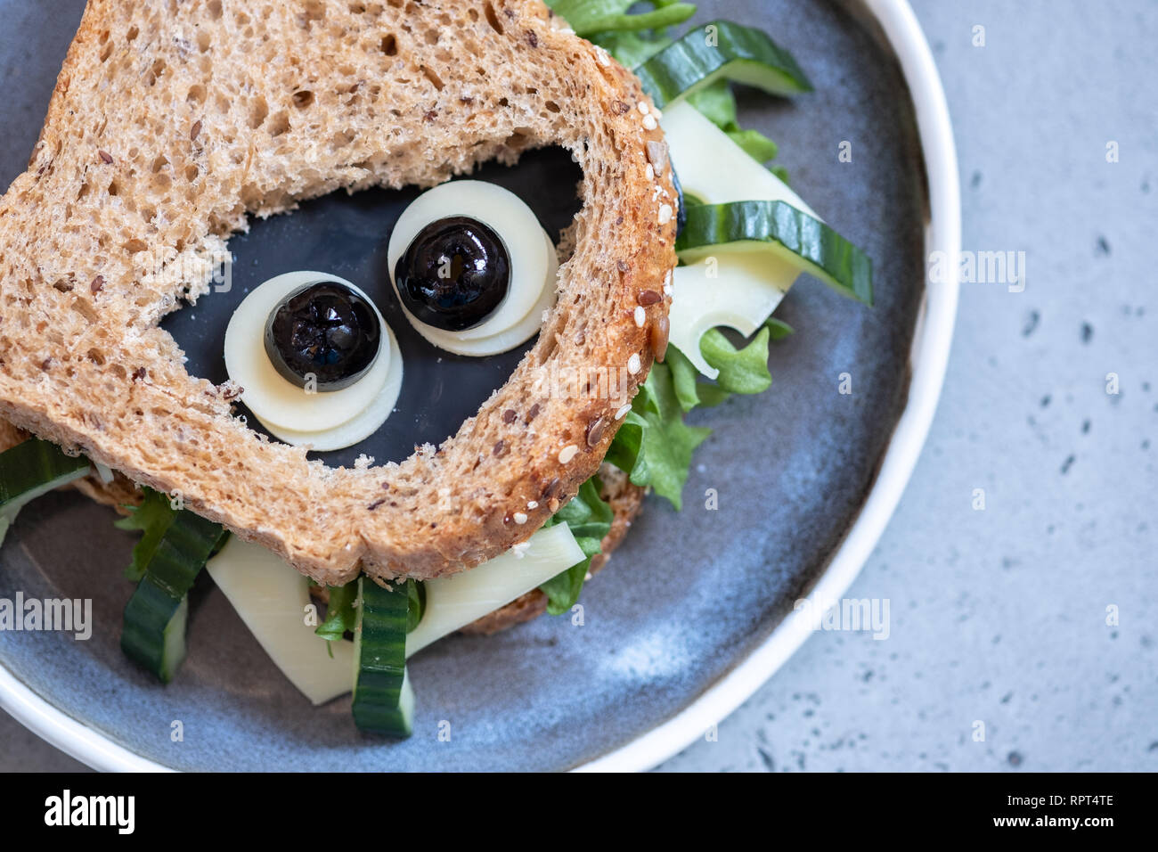 Funny spider sandwich with black cheese and olives for Halloween party ...
