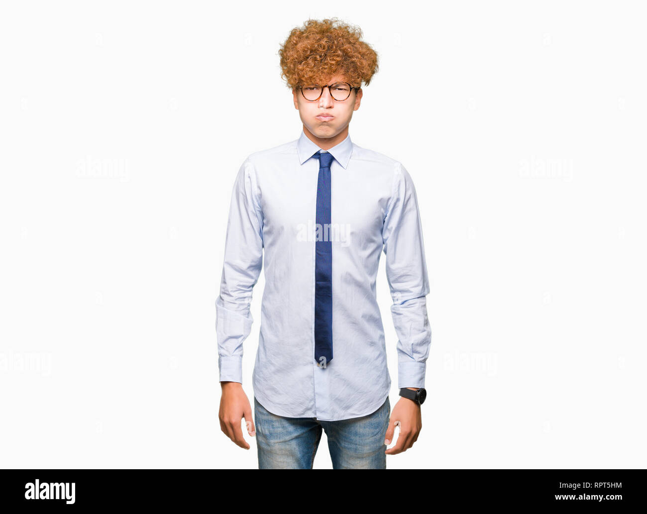 Young handsome business man with afro wearing glasses puffing cheeks ...