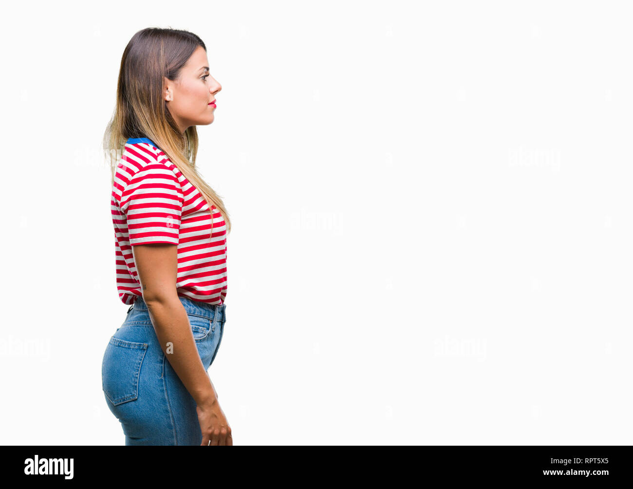 Young beautiful woman casual look over isolated background looking to ...