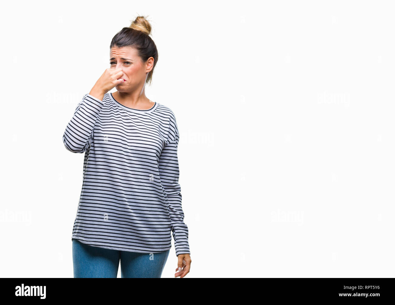 Young beautiful woman casual stripes sweater over isolated background ...