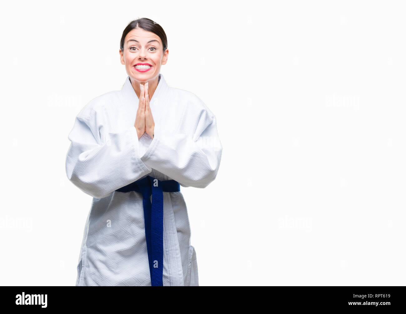 Young beautiful woman wearing karate kimono uniform over isolated ...
