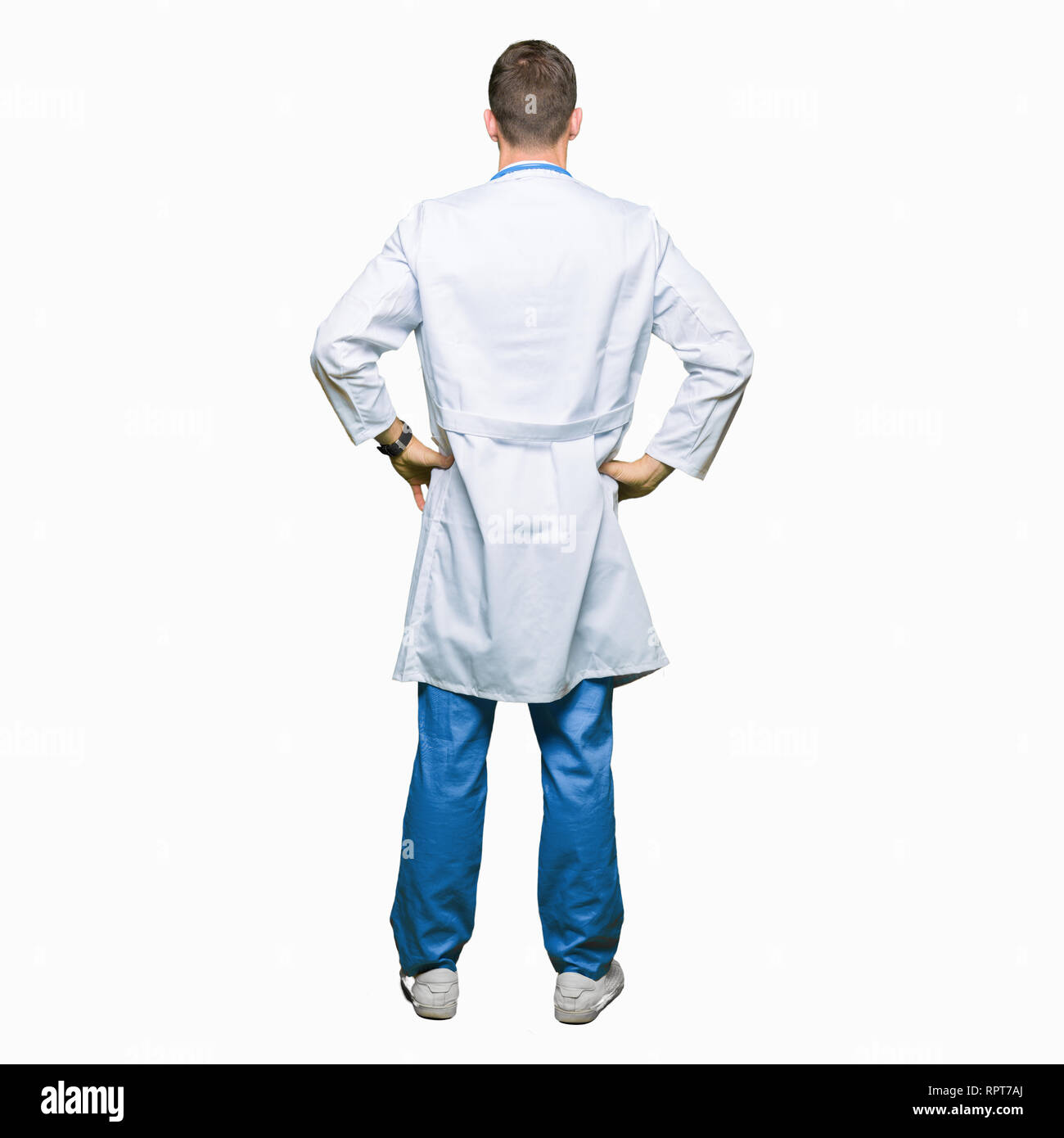 Handsome doctor man wearing medical uniform over isolated background ...