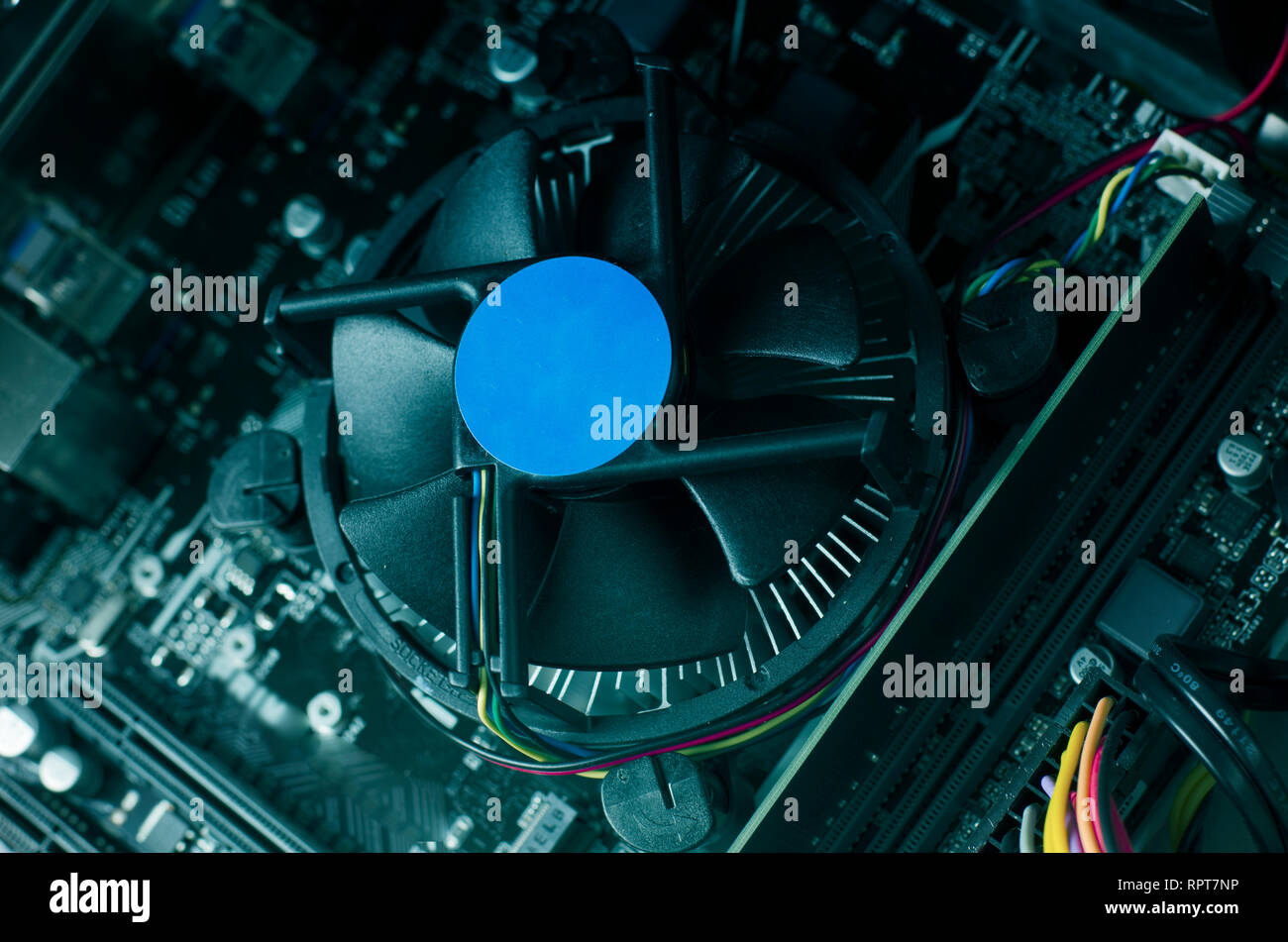 Close up photo with motherboard of computer and its fan Stock Photo - Alamy