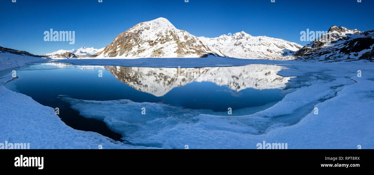 Panoramic of Lake Montespluga during the spring thaw, Valchiavenna ...