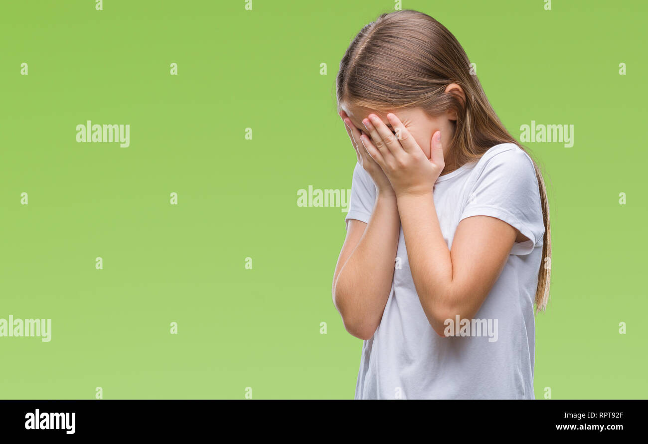 Young beautiful girl over isolated background with sad expression ...