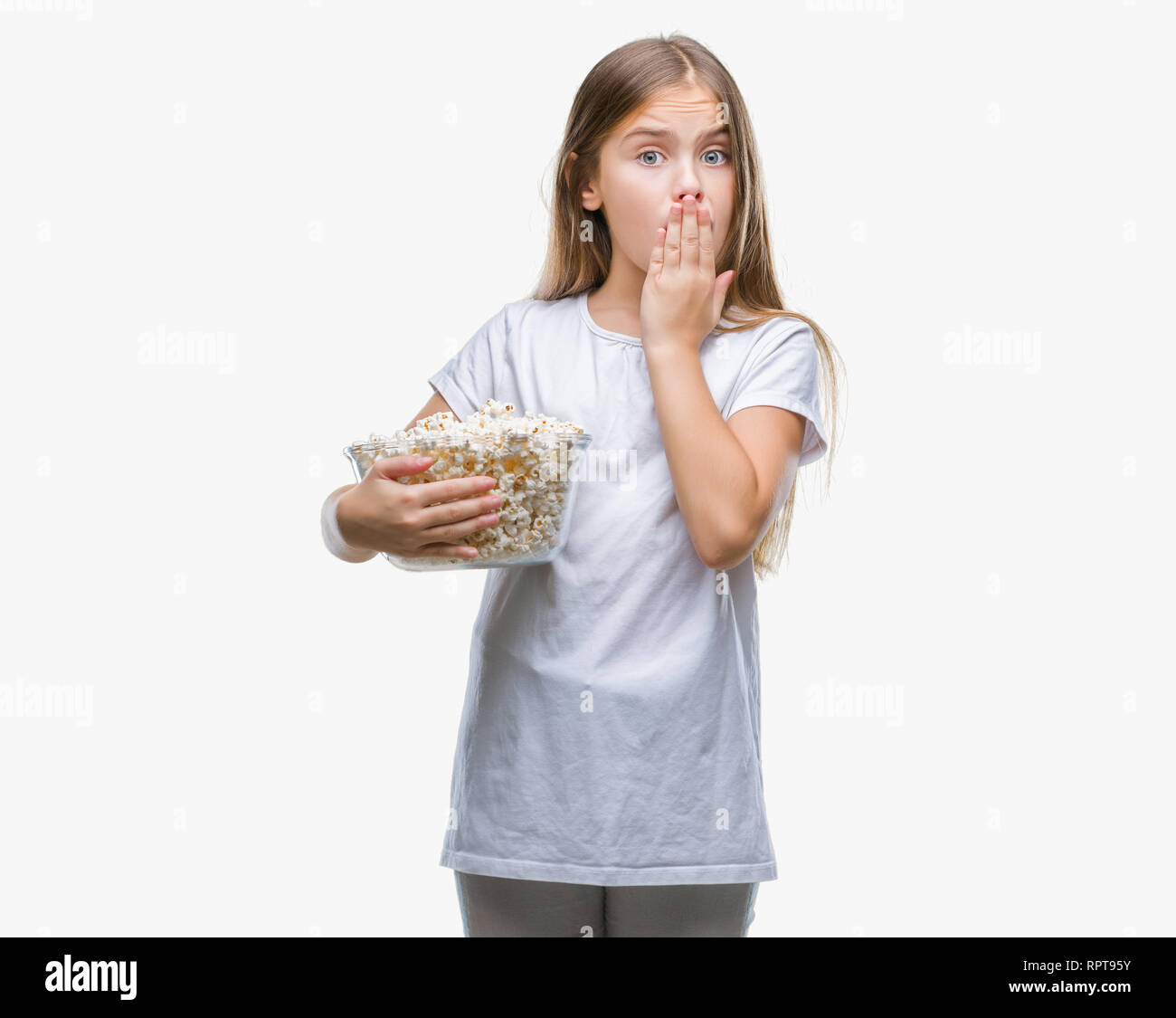 Young beautiful girl eating popcorn snack isolated background cover ...