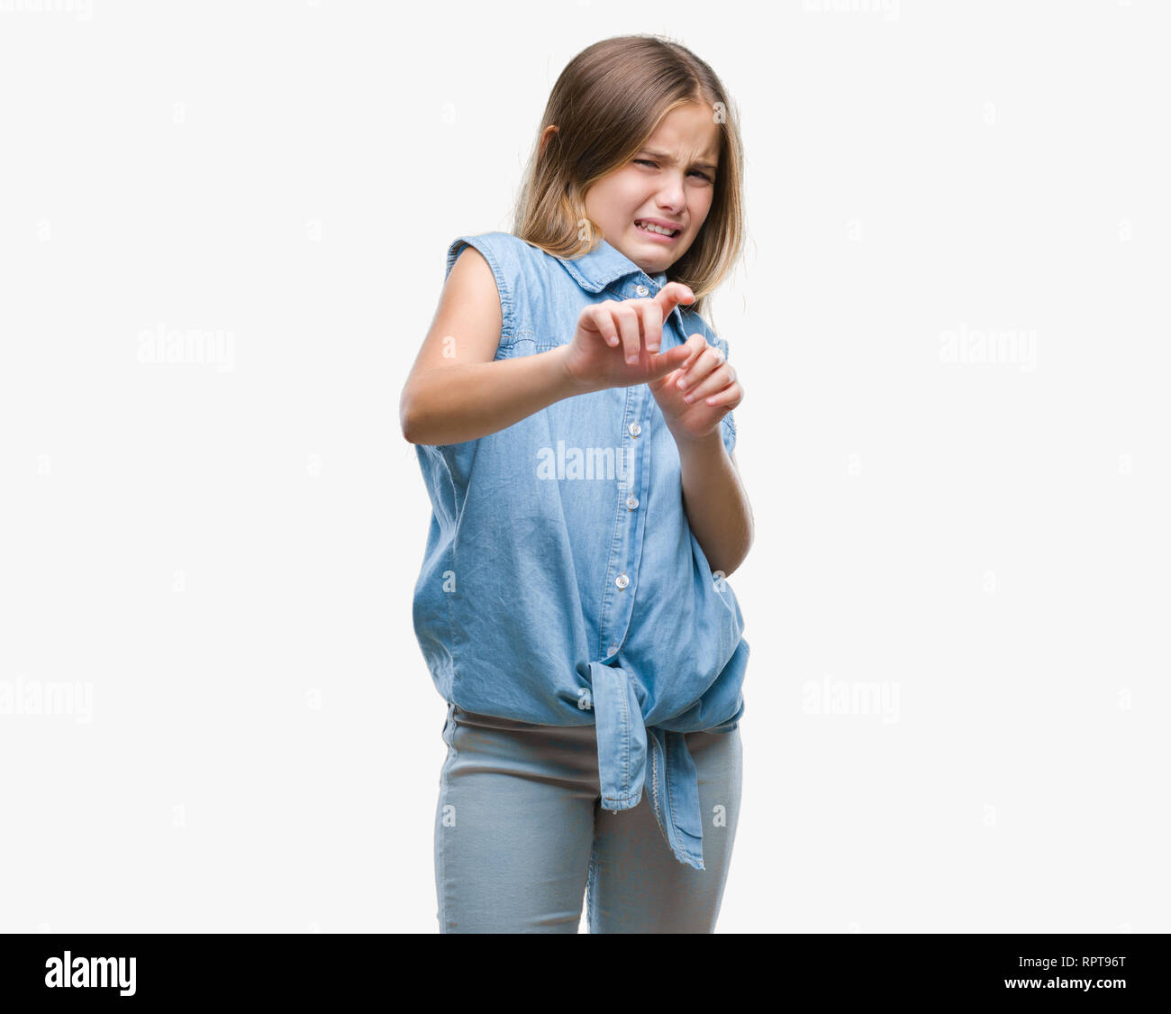 Young beautiful girl over isolated background disgusted expression ...
