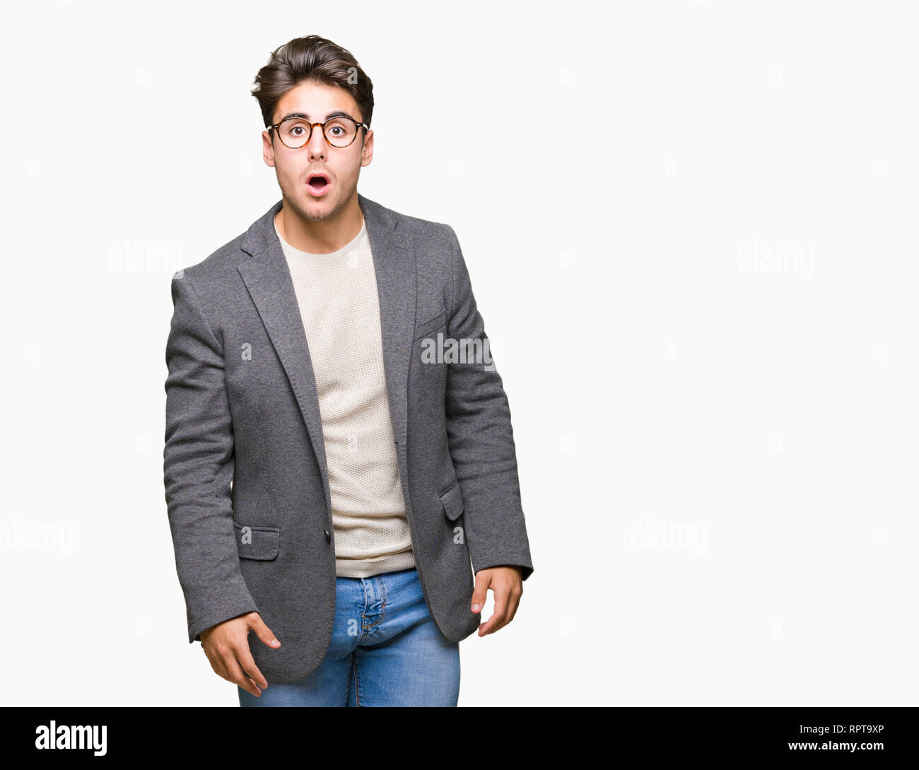 Young business man wearing glasses over isolated background In shock ...