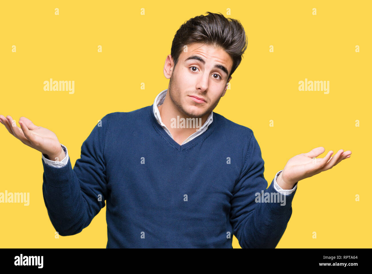 Young handsome business man over isolated background clueless and ...