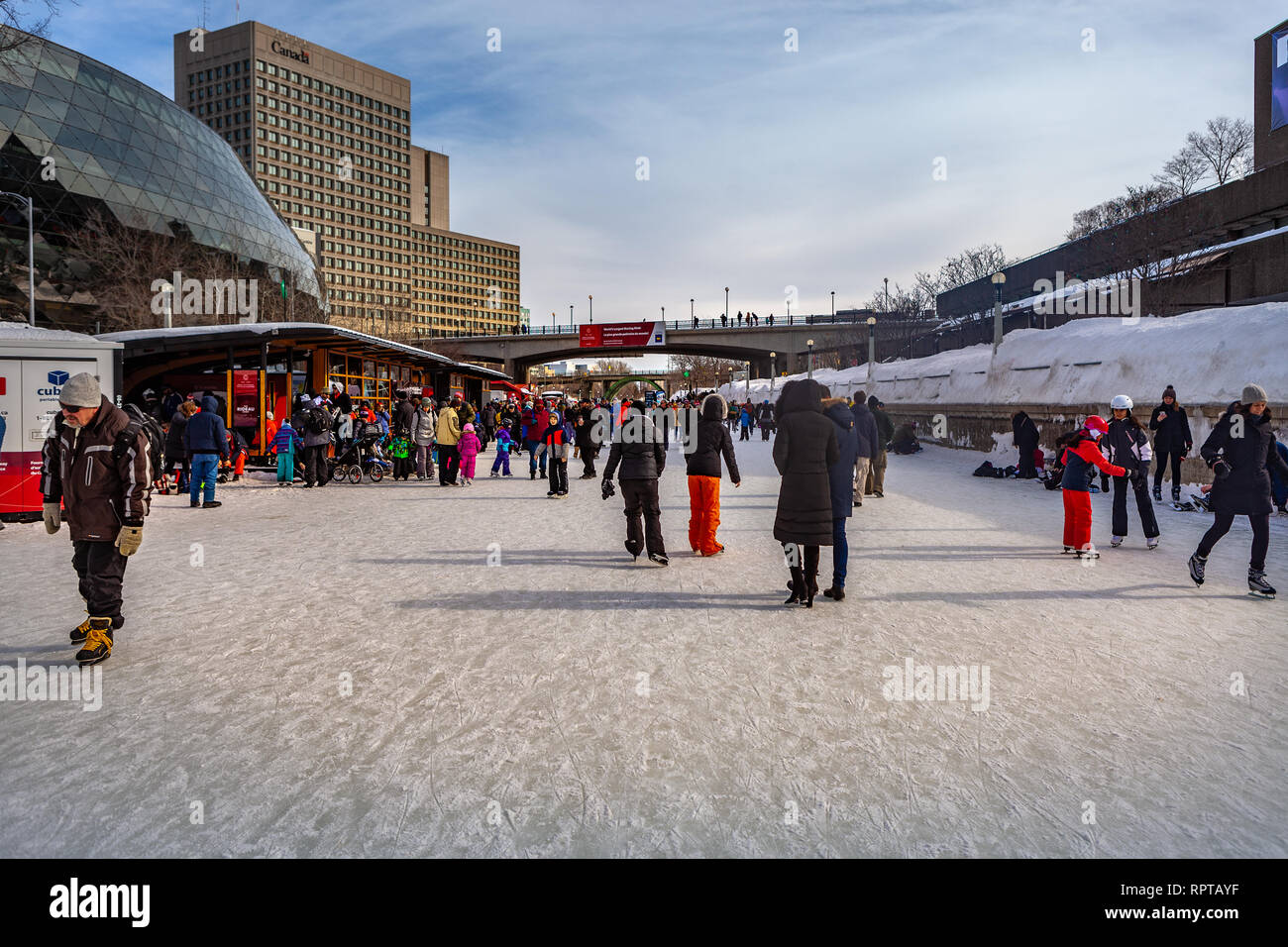 People celebrate the Winterlude festival on the frozen Rideau Canal ...