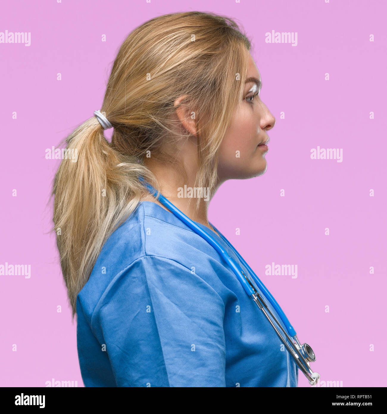 Young caucasian doctor woman wearing surgeon uniform over isolated ...