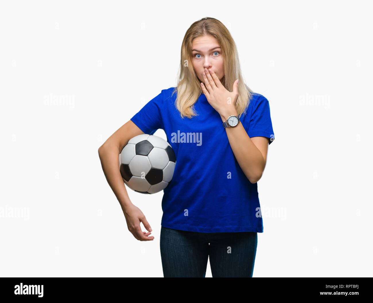 Young caucasian woman holding soccer ball over isolated background ...