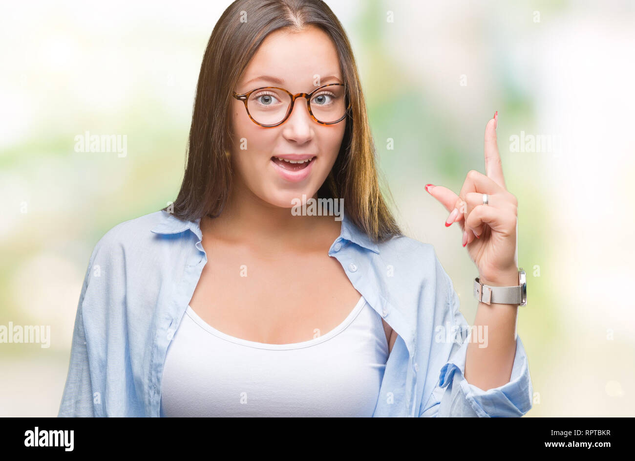 Young caucasian beautiful business woman wearing glasses over isolated ...