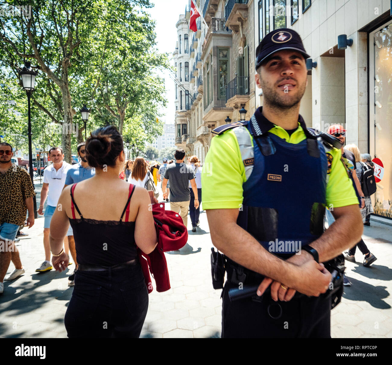 BARCELONA, SPAIN - JUN 1, 2018: Police officer surveilling people on ...