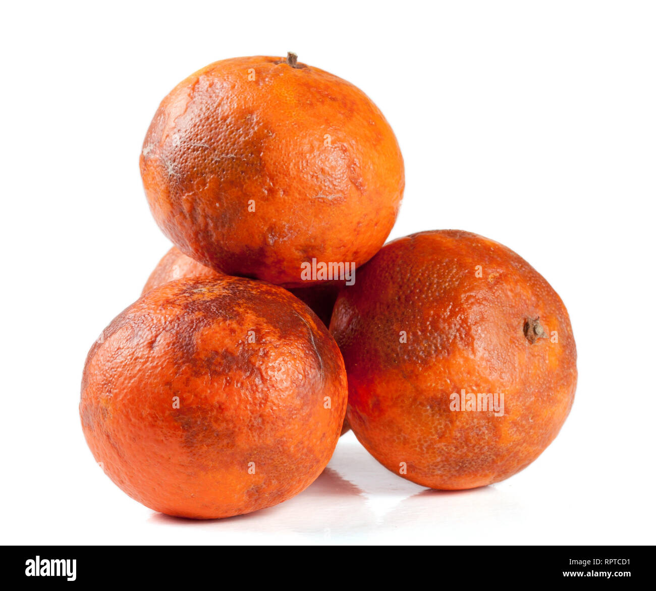 three damaged tangerine isolated on white background Stock Photo - Alamy