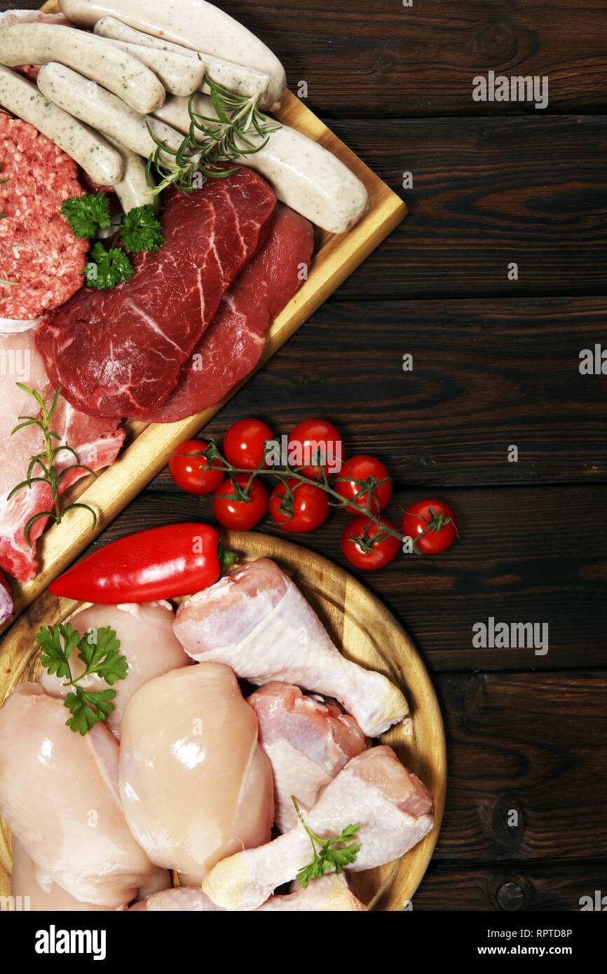 raw meat. Different types of raw pork meat, chicken and beef with ...