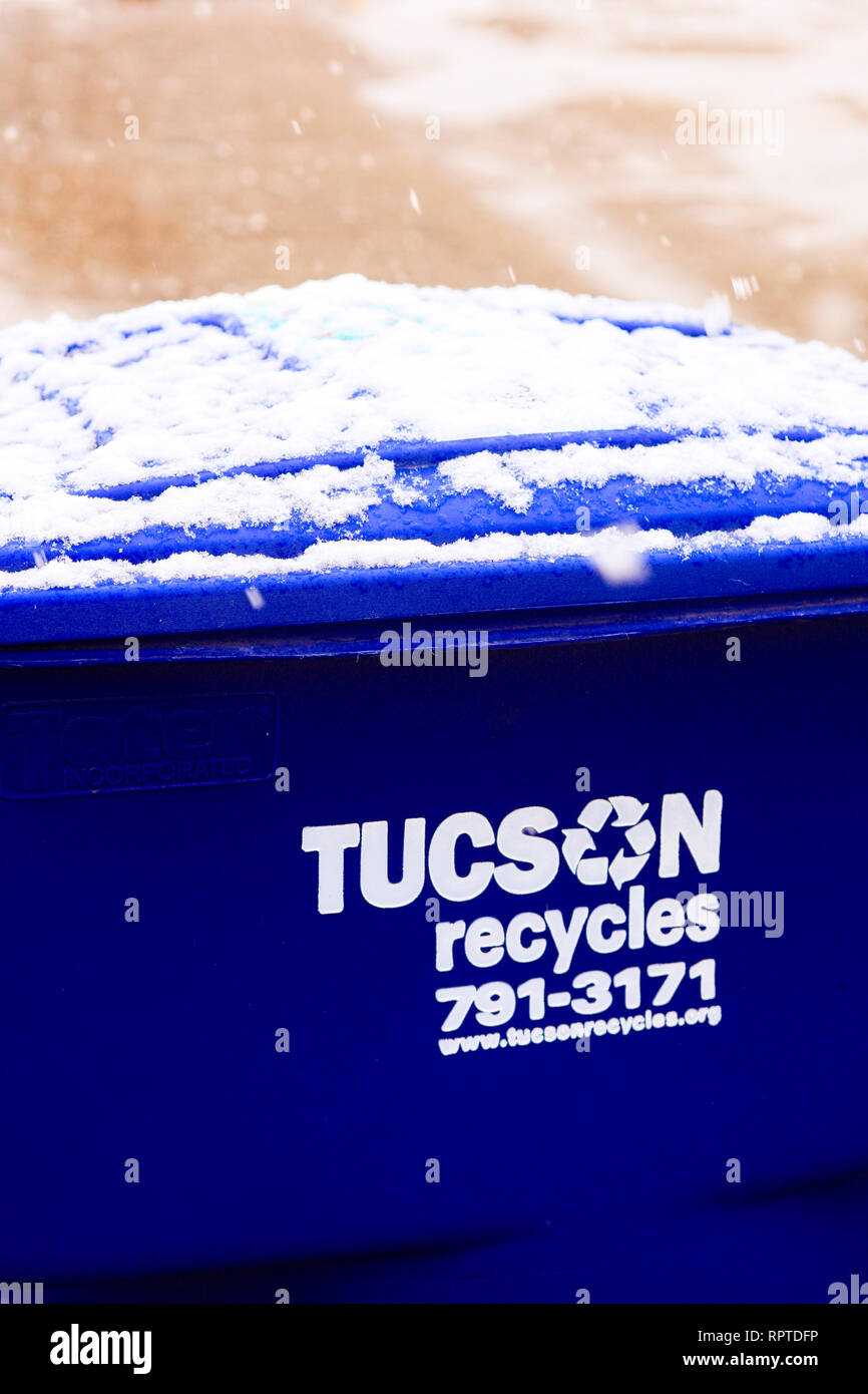 Snow on top of a blue recycling trash can in Tucson Arizona Stock Photo ...