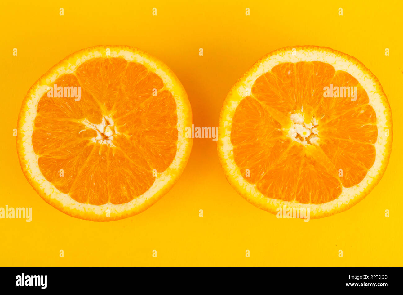 Two halves of cut orange, top view. Studio Photo Stock Photo - Alamy