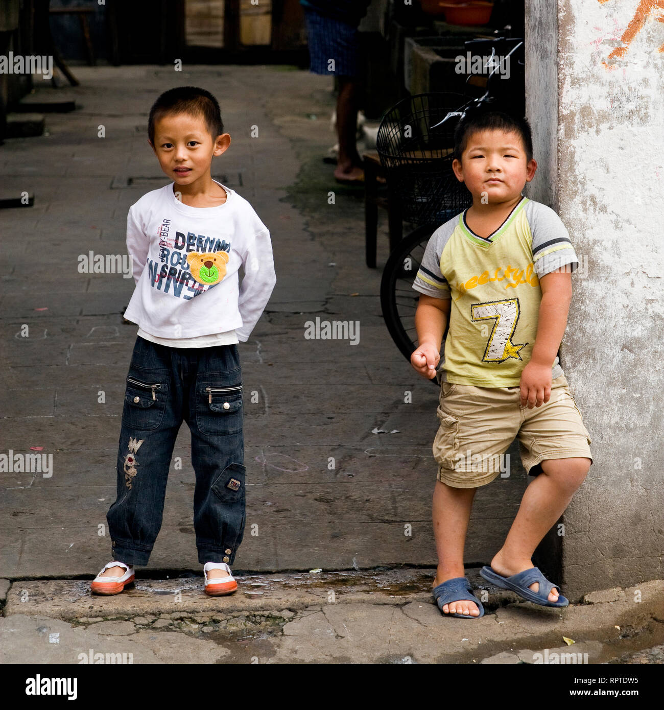 Two curious boys in ''their'' street in Shanghai, China Stock Photo - Alamy