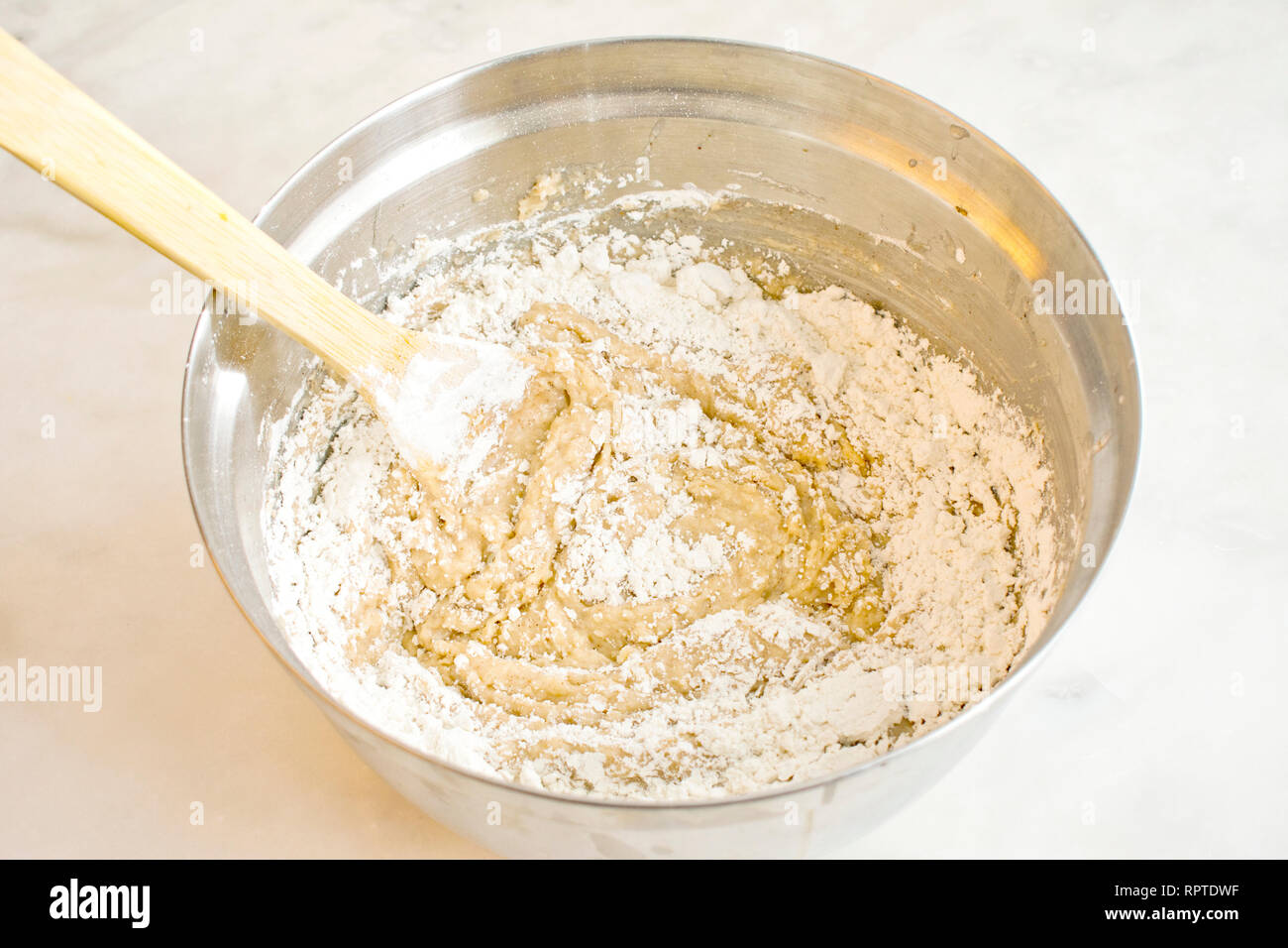 Mixing Flour Into Toto Cake Batter Stock Photo - Alamy