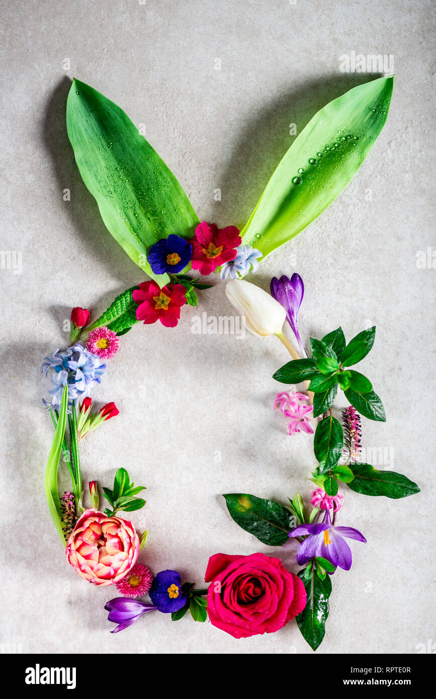 Easter minimal concept. Egg shape with bunny ears made from spring ...