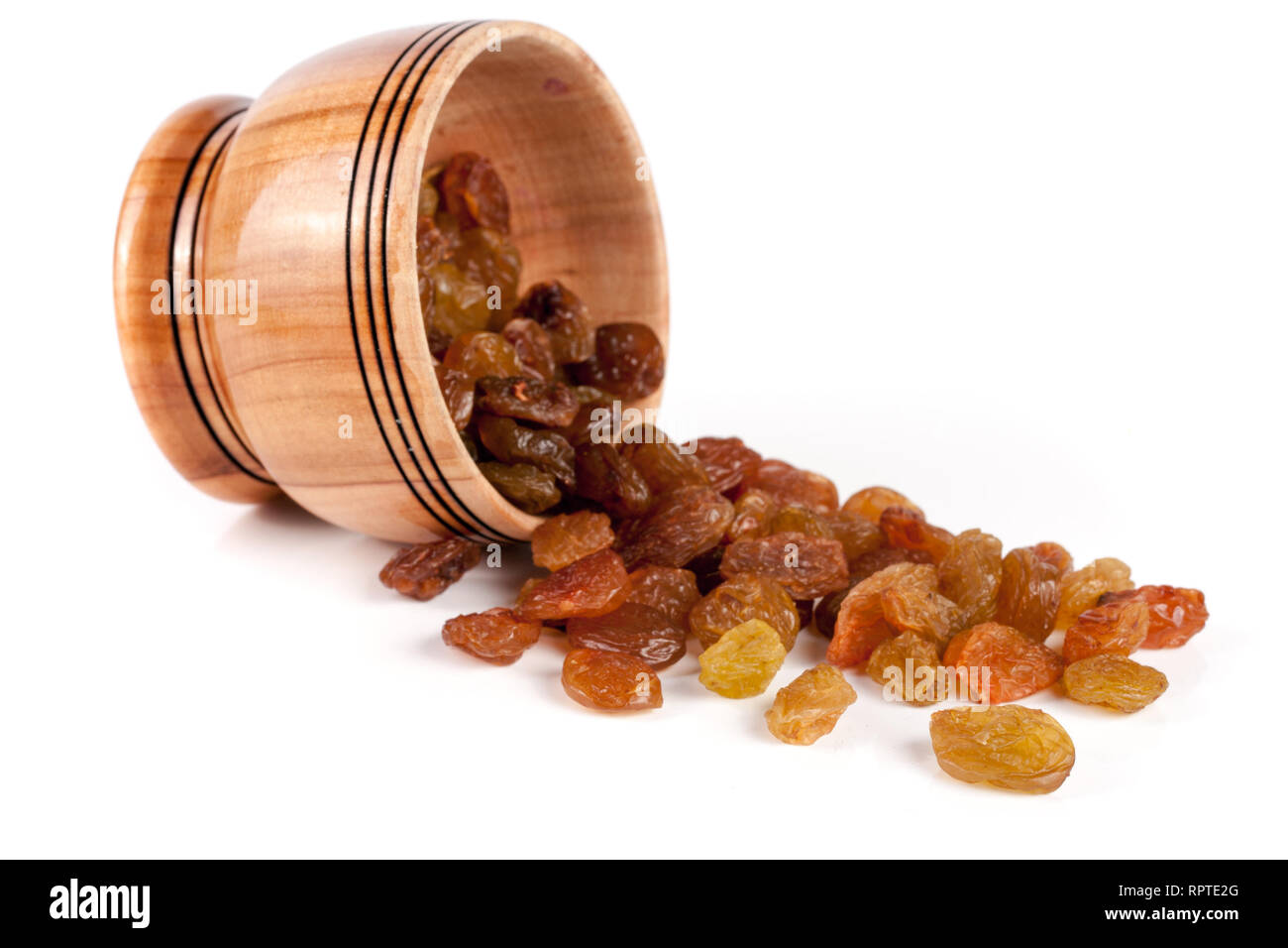 raisins in a wooden bowl isolated on white background Stock Photo - Alamy