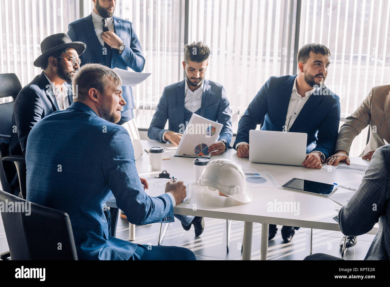 Close up top view of confident business men of different race and ages ...