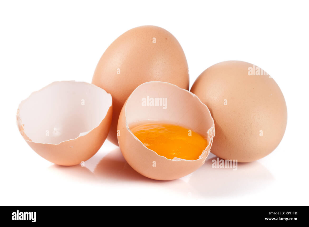 two whole eggs and broken egg isolated on white background Stock Photo ...
