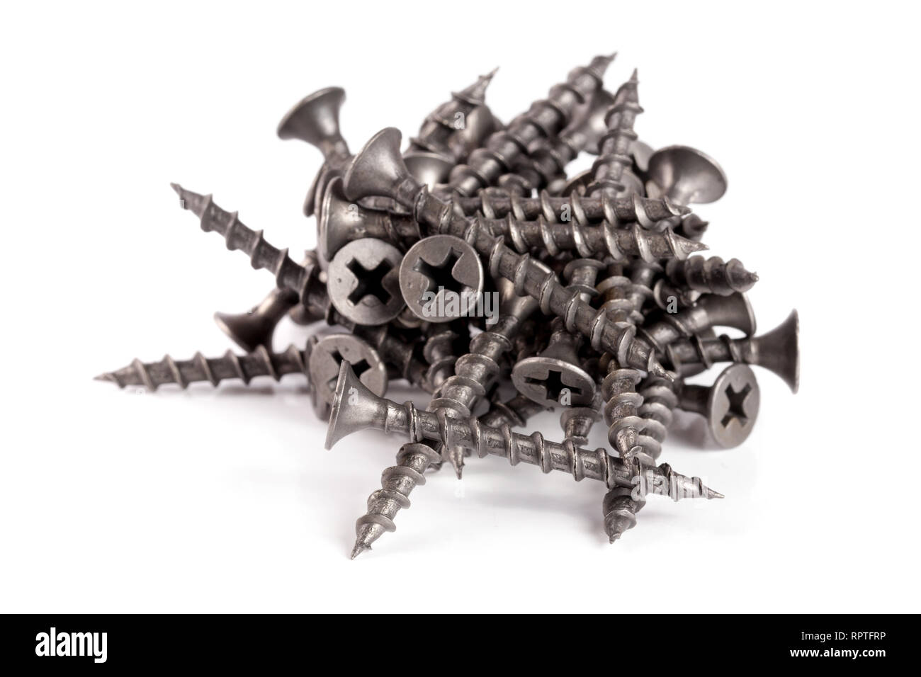 pile of metal screws isolated on white background Stock Photo - Alamy