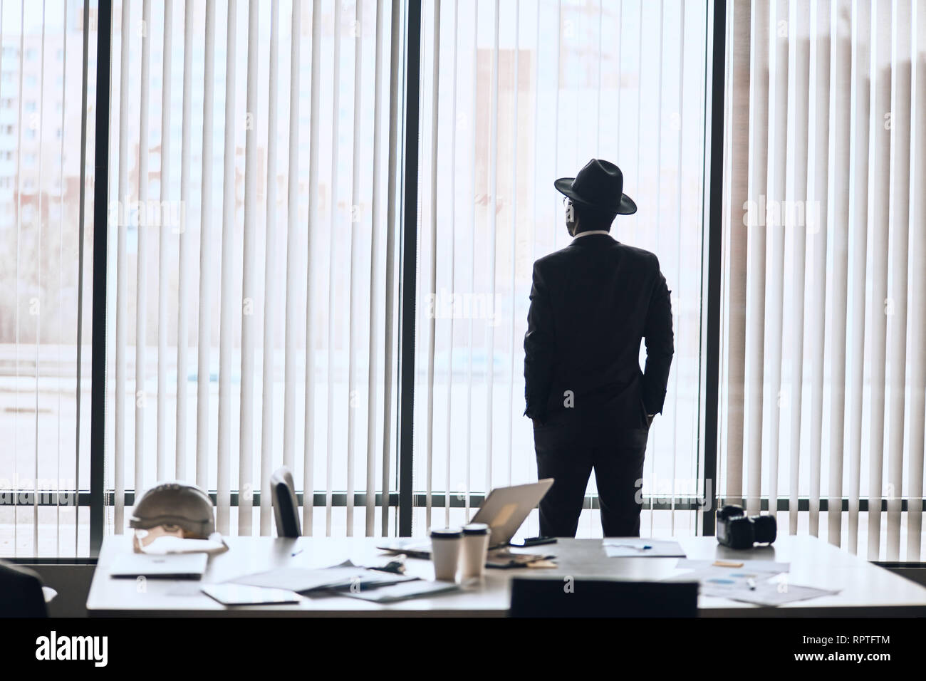 Single businessman in stylish outfit waiting for meeting. back view ...