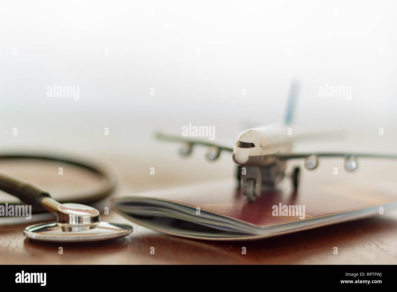 Stethoscope , passport document and airplane: Medical Travel concept ...